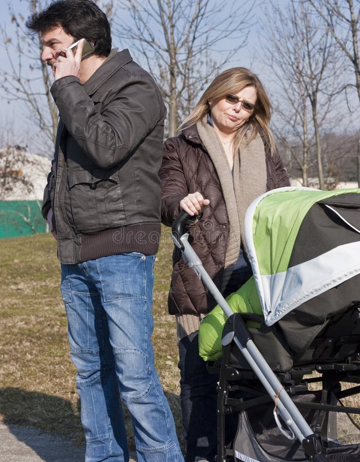 Family with Stroller stock photo. Image of buggy, married - 18950562
