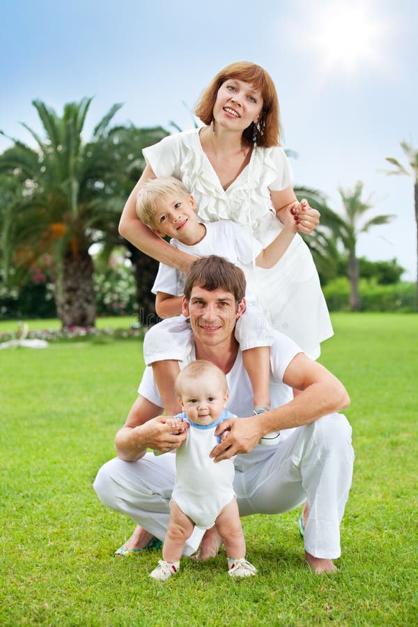 Family in summer park stock image. Image of child, green - 23671123