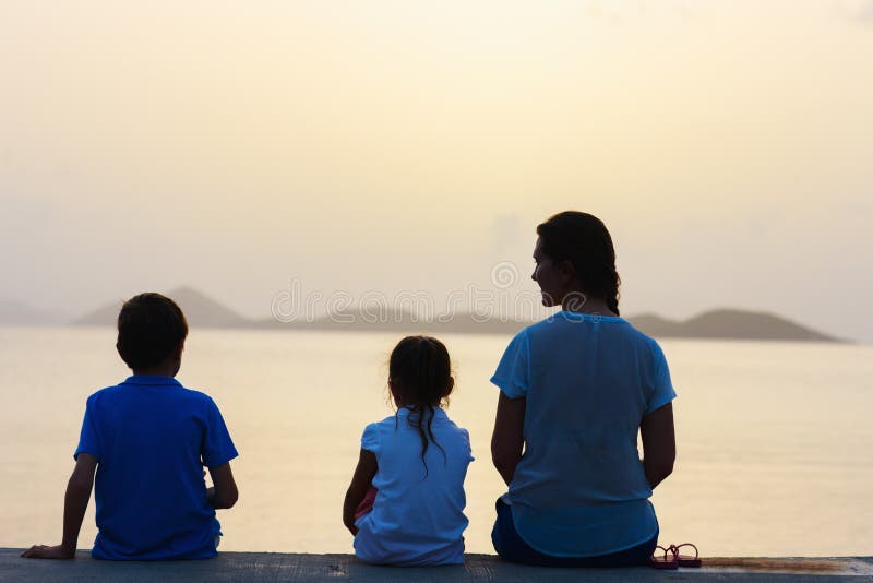 Family at sunset stock photo. Image of orange, holding - 13769652