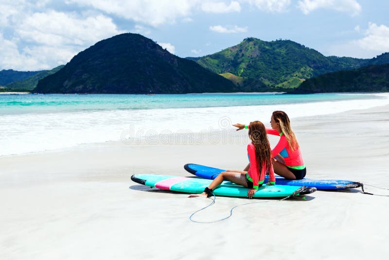 Family surfing stock image. Image of bali, girl, indonesia - 70115625