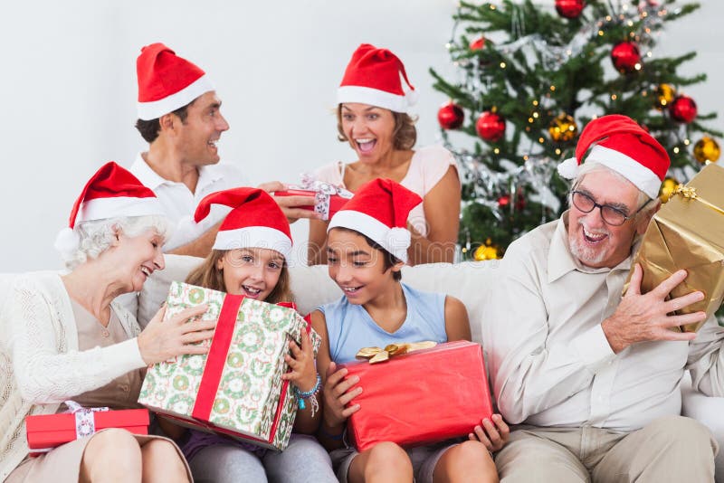 Family Swapping Christmas Presents Stock Photo - Image of decorations ...