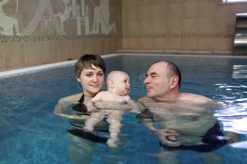 Family swimming in pool stock photo. Image of comfortable - 25238928