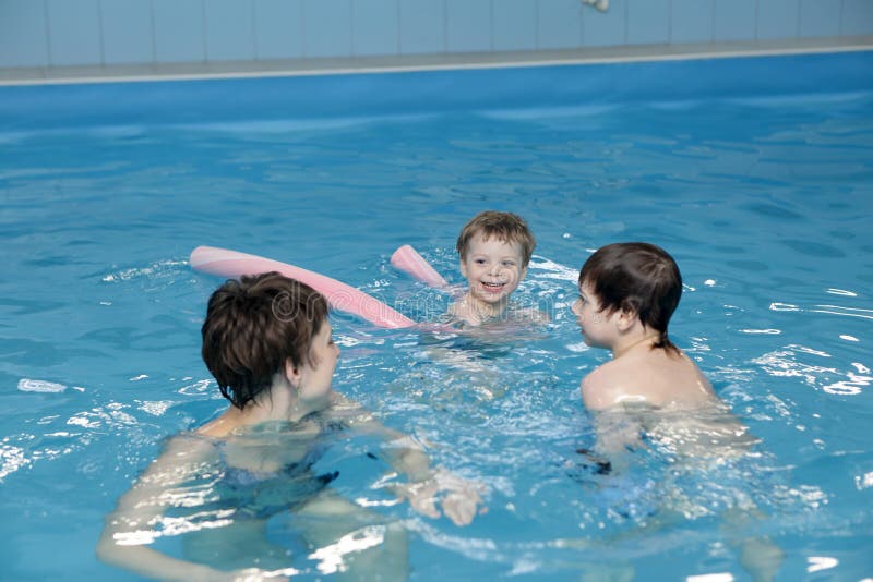 Family in swimming pool stock photo. Image of leisure - 91110994