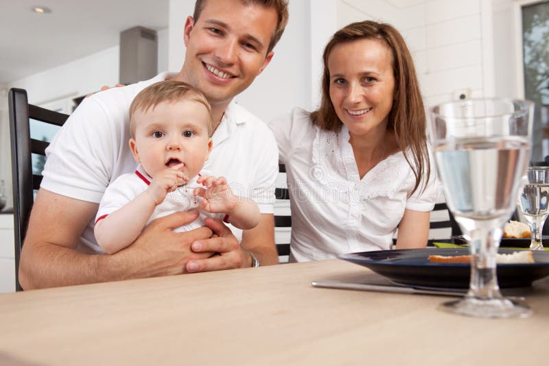 Family at Table stock image. Image of adult, female, meal - 20991013
