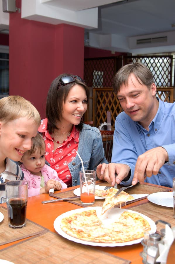 Family at table stock image. Image of male, comfort, pleasure - 21968891