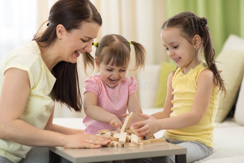 Family at the Table Playing Board Game Stock Photo - Image of kids ...