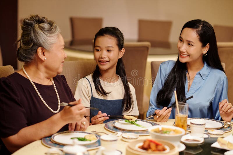 Family Talking at Dinner at the Restaurant Stock Photo - Image of ...