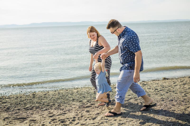 Family of Three on Beach Having Fun Together Stock Photo - Image of ...