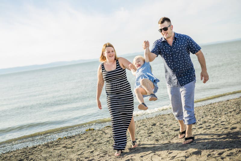 Family of Three on Beach Having Fun Together Stock Photo - Image of ...