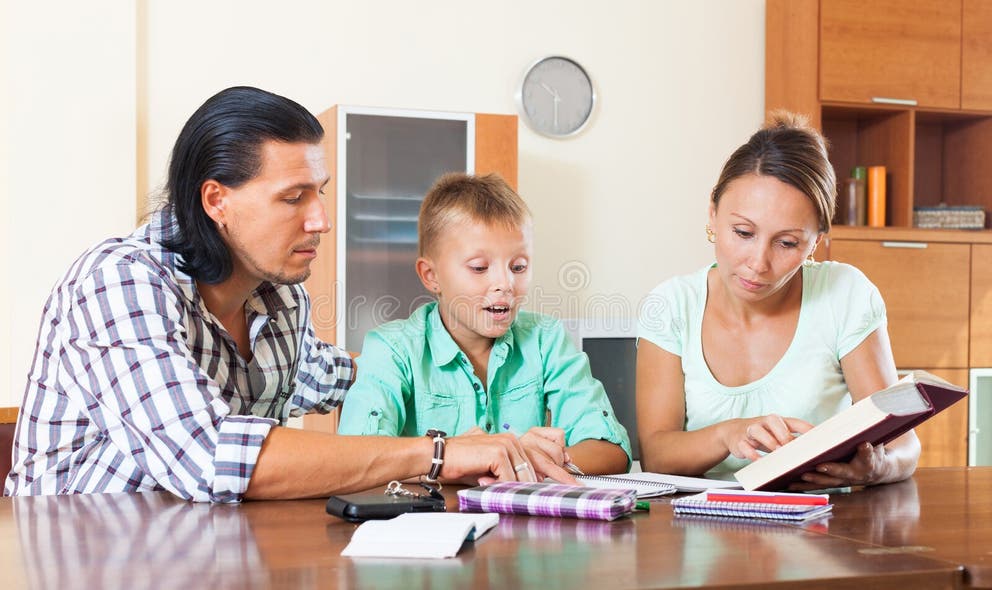 Family of Three Doing Homework in Home Stock Image - Image of book ...