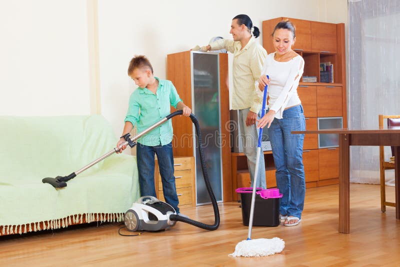 Family of Three Doing Housework Stock Photo - Image of assistance ...