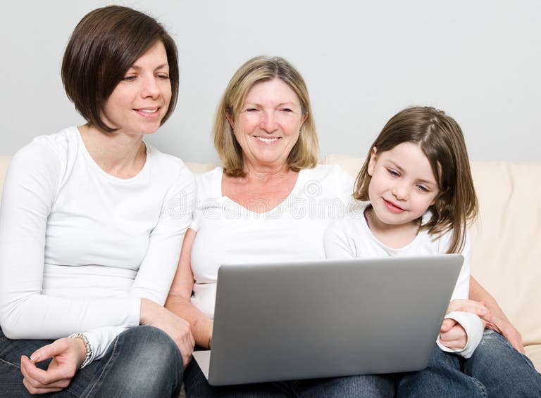Family of Three Generations Using a Laptop Stock Photo - Image of ...