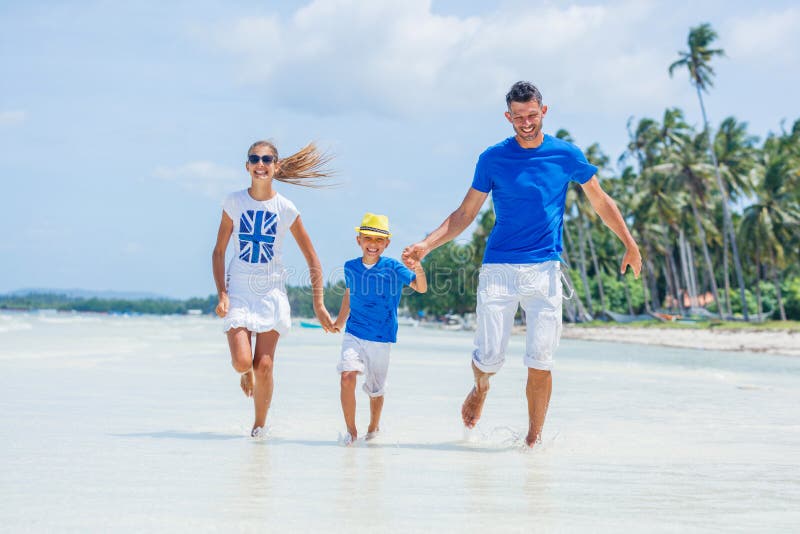 Family of Three Having Fun at the Beach Stock Image - Image of lagoon ...