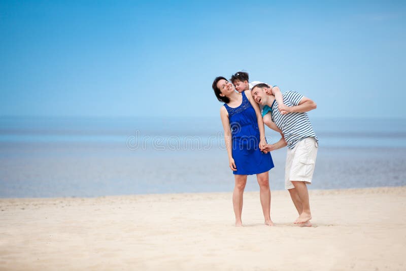 Family of Three Having Fun on Tropical Beach Stock Photo - Image of ...