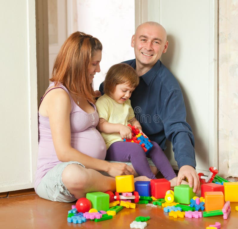 Family of three in home stock image. Image of anticipation - 50809133