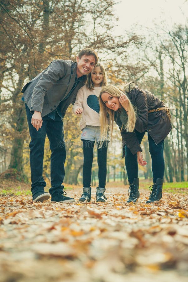 Family of three playing stock image. Image of father - 70635381