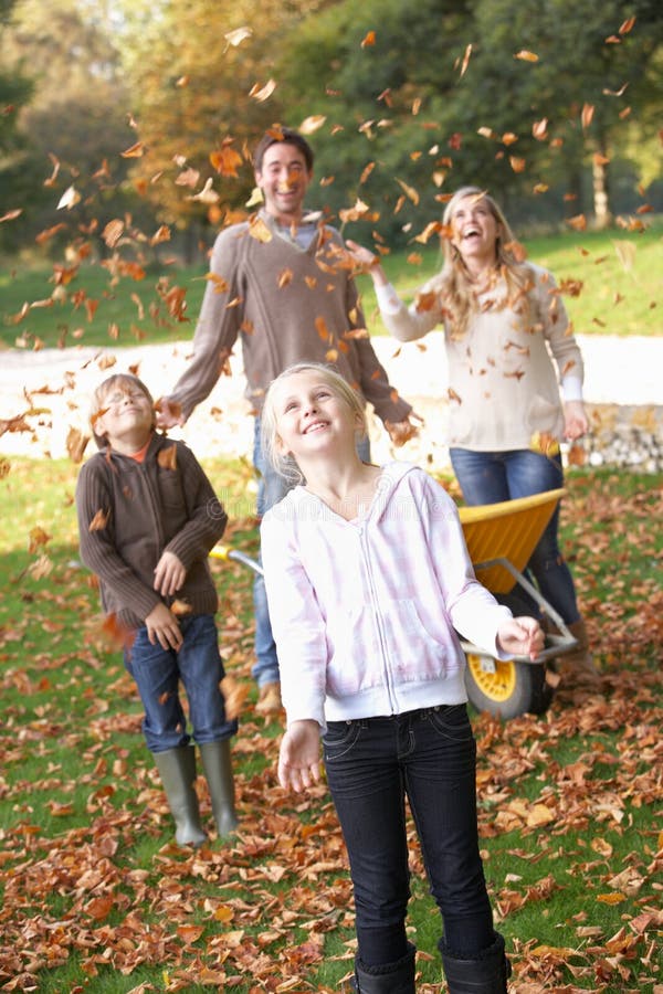 Family Throwing Autumn Leaves into the Air Stock Image - Image of ...