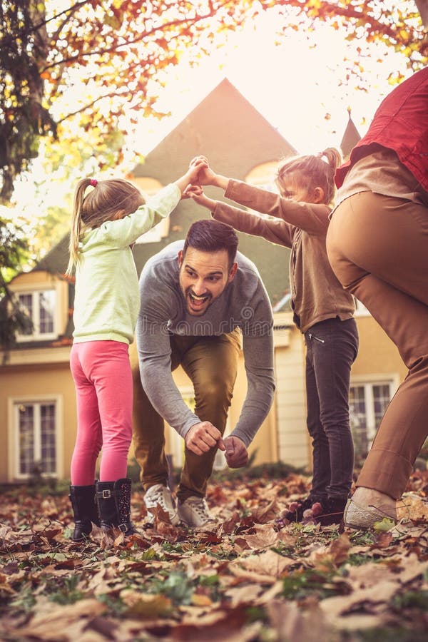 Family Time, Parents Play with Daughters at Backyard. Stock Photo ...