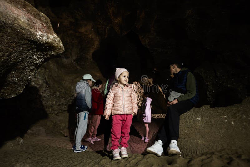 Family Tourists Walking in Cave and Explore it Stock Photo - Image of ...