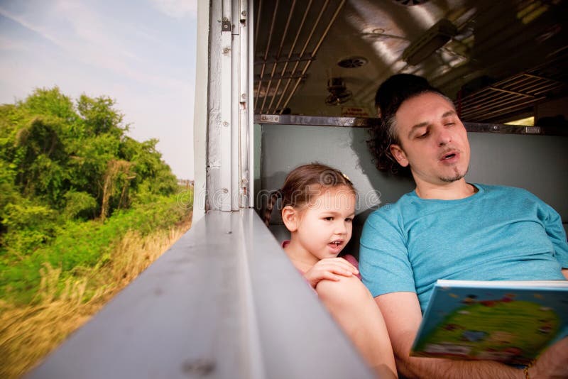 Family on the Train Reading a Book Stock Image - Image of girl, nature ...