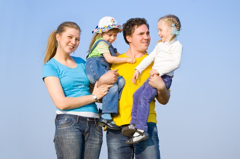 A family with two children stock photo. Image of love - 19580292