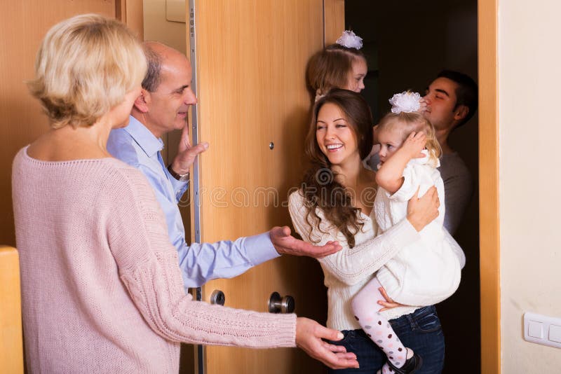 Family with Two Daughters Visiting Grand Parents Stock Photo - Image of ...
