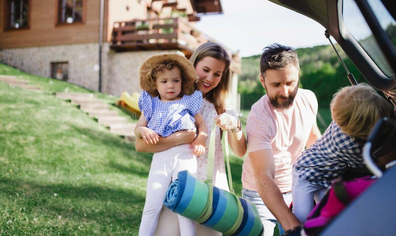 Family with Two Small Children Loading Car for Trip in Countryside ...
