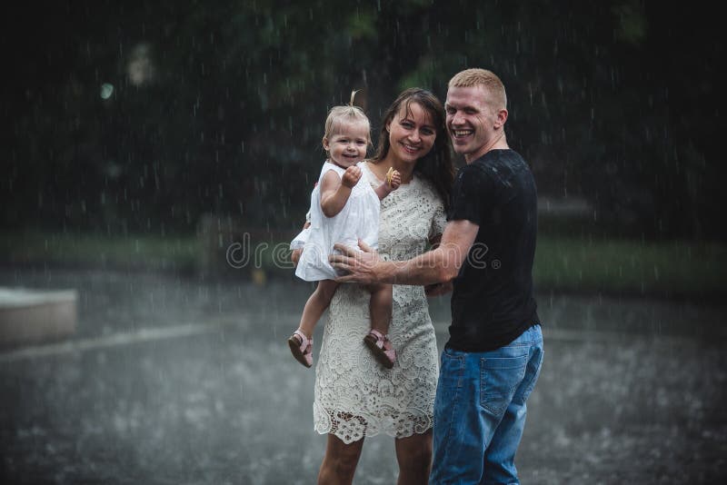 Family under the rain stock image. Image of american - 50589383