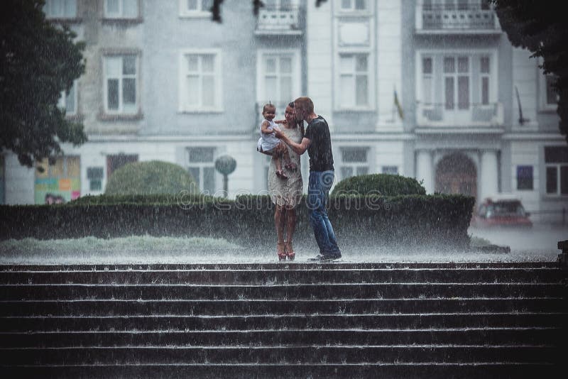 Family under the rain stock image. Image of green, group - 50589373