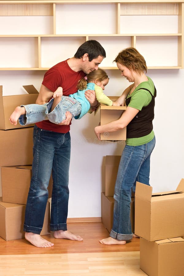 Family Unpacking from Lots of Cardboard Boxes Stock Photo - Image of ...