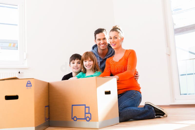 Family Unpacking Moving Boxes in New Home Stock Photo - Image of home ...