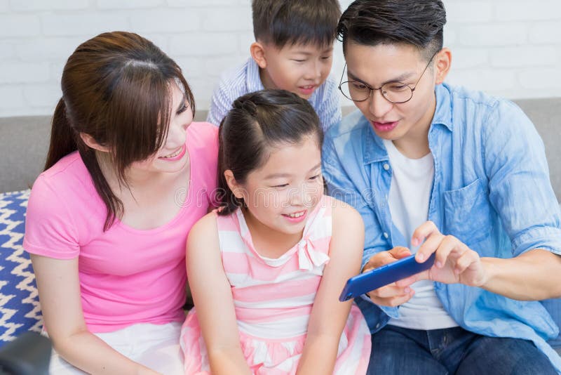 Family use phone happily stock photo. Image of screen - 120414592