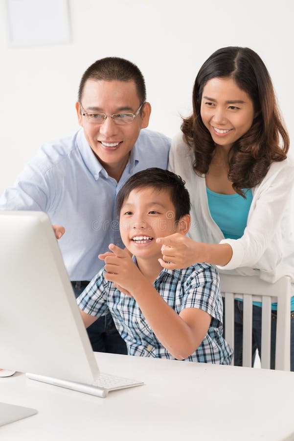 Family using computer stock image. Image of concept, modern - 53735963
