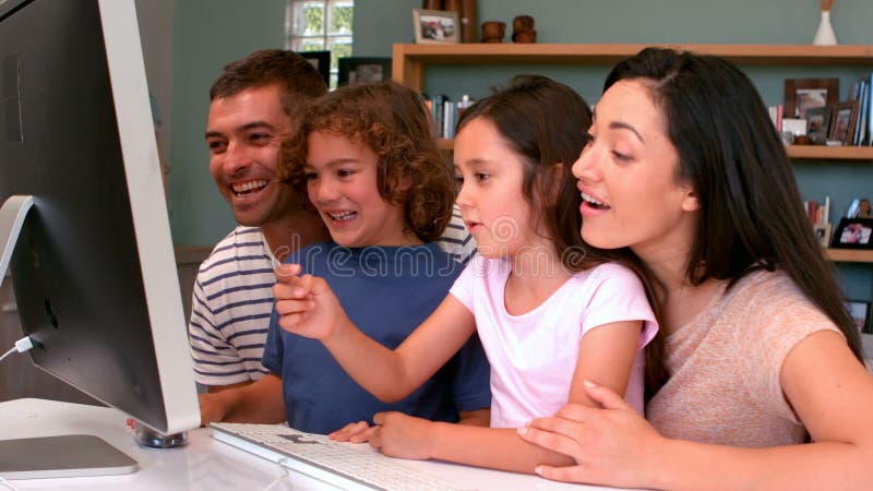 Family Using Computer Together Stock Footage - Video of four, filming ...