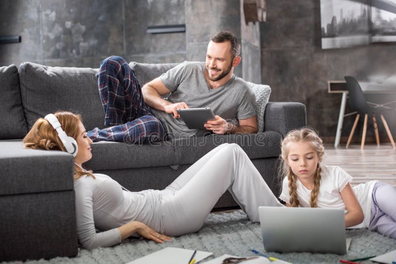 Family Using Various Digital Devices Stock Photo - Image of children ...