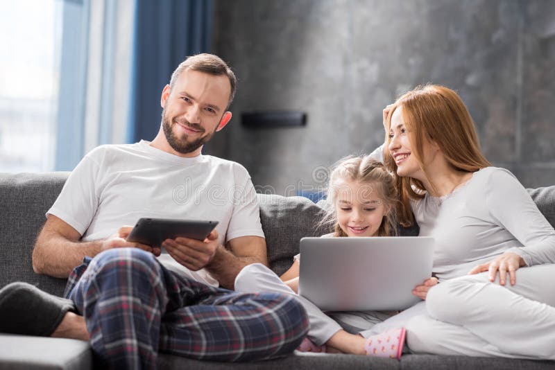 Family Using Digital Devices Stock Image - Image of horizontal, male ...