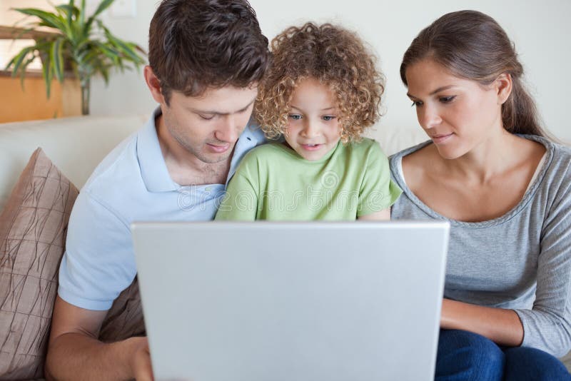 Family using a laptop stock photo. Image of beautiful - 22660782