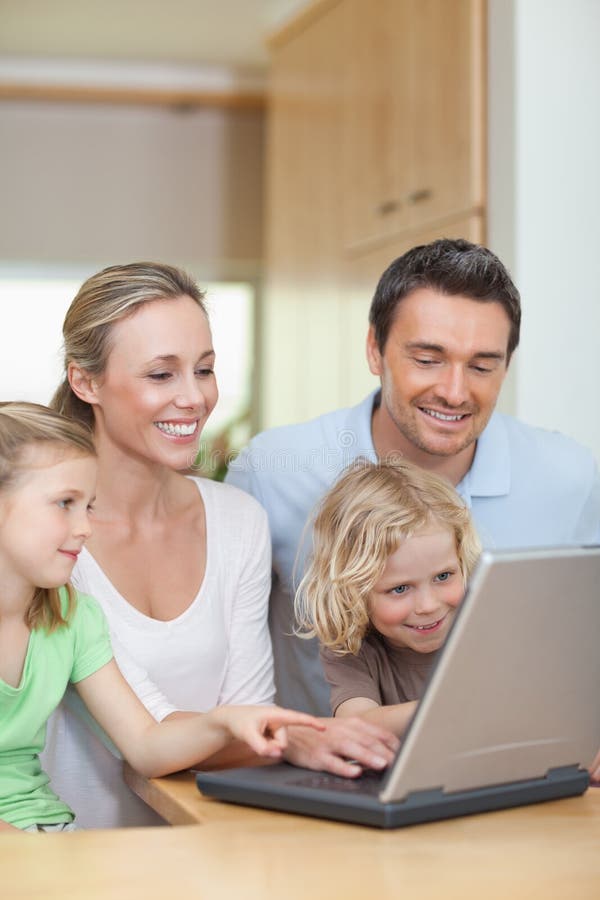 Family using computer stock photo. Image of laptop, schoolwork - 2046126