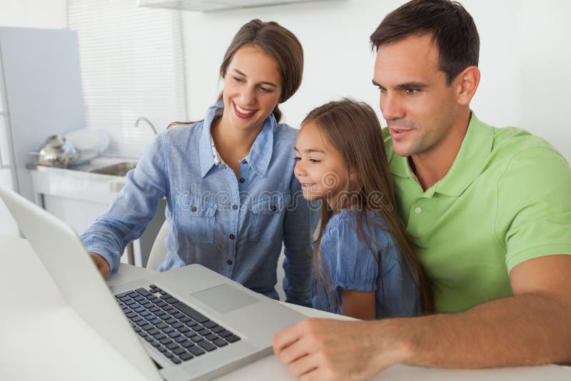 Family Using a Laptop Pc in the Kitchen Stock Photo - Image of ...