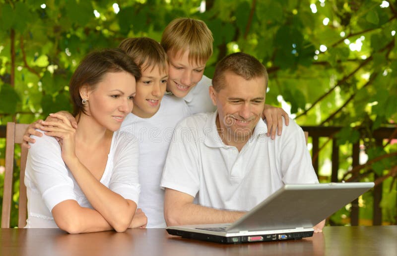 Family using laptop stock image. Image of generations - 84422829