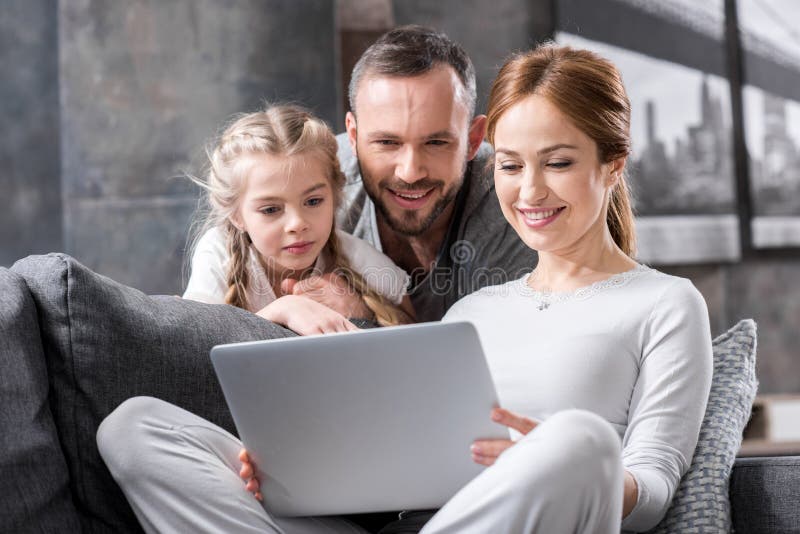 Family Using Laptop Together Stock Photo - Image of together, computer ...