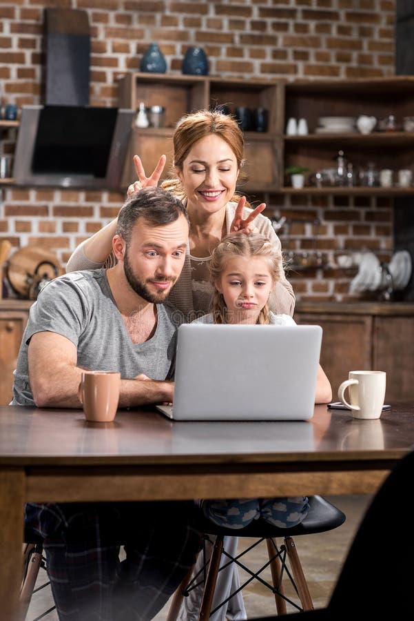 Family using laptop stock photo. Image of view, gesturing - 90083584