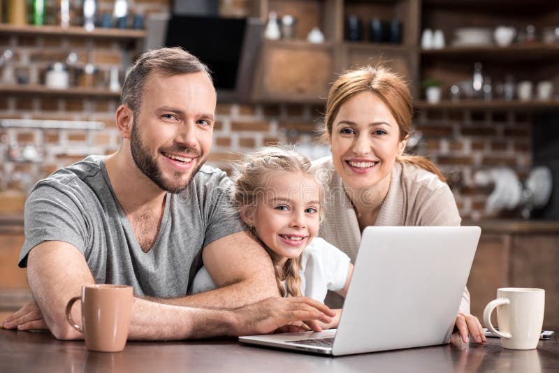 Family using laptop stock photo. Image of happiness, computer - 90083378