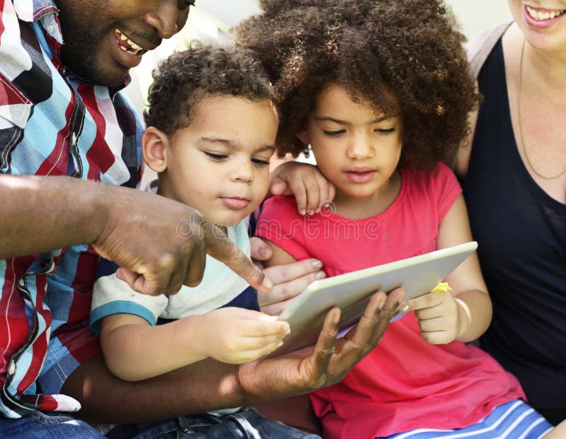 Family Using a Tablet Together Stock Photo - Image of generation ...