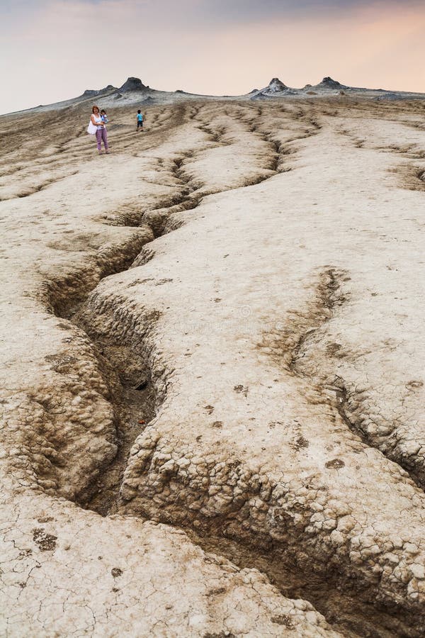 Family Visiting Mud Volcanoes Stock Photo - Image of visiting, earth ...
