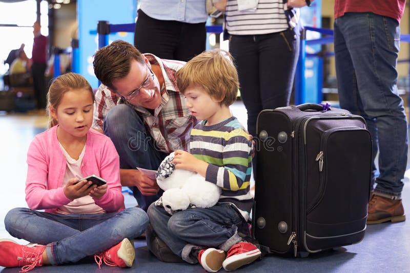 Family Wait in Queue at Airport Check in Stock Photo - Image of years ...