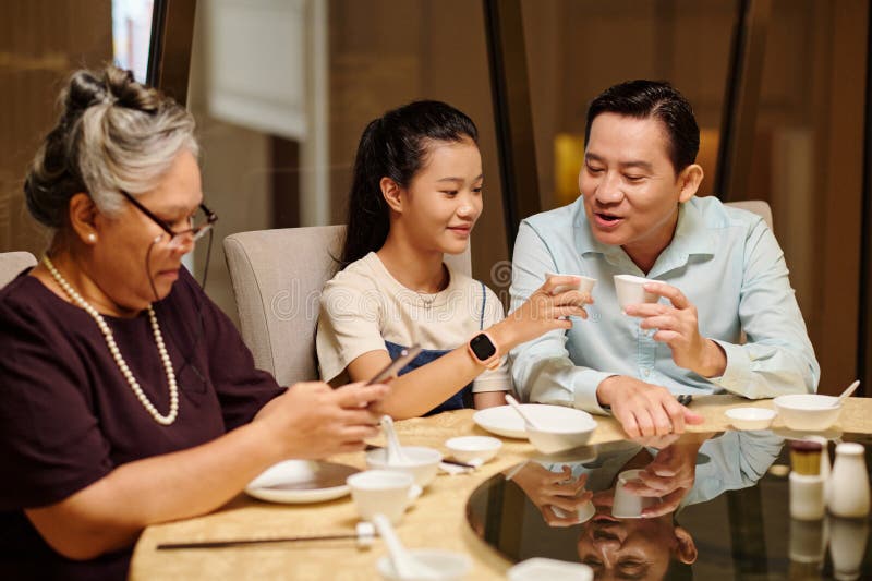 Family Waiting for Dinner in the Restaurant Stock Photo - Image of ...