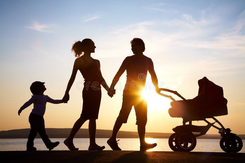 Family walk at sunset stock image. Image of parents, people - 21029087