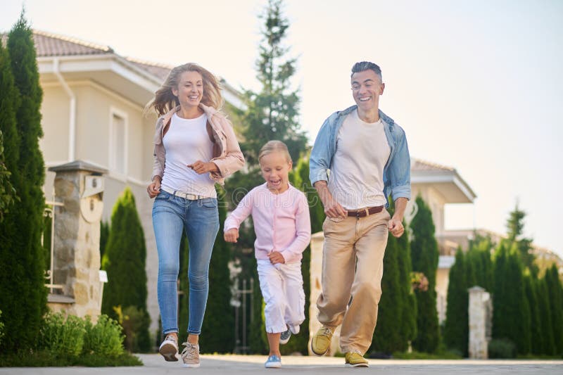 Young Family Having a Walk and Enjoying Stock Photo - Image of ...