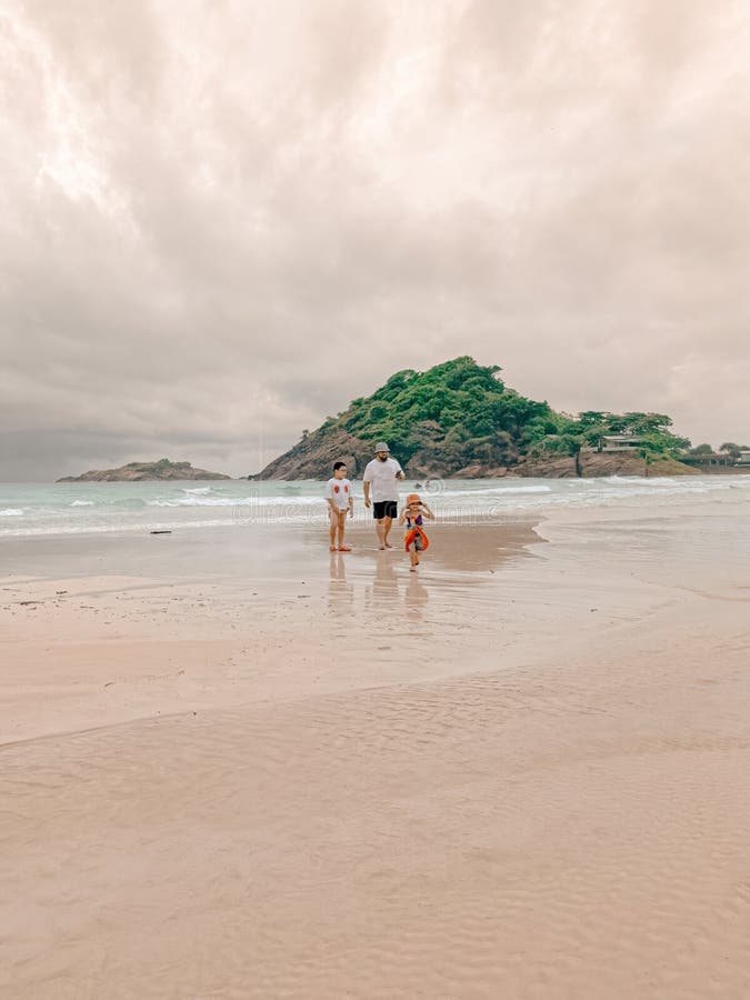 A Family is Walking on the Beach. Low-angle View Stock Photo - Image of ...